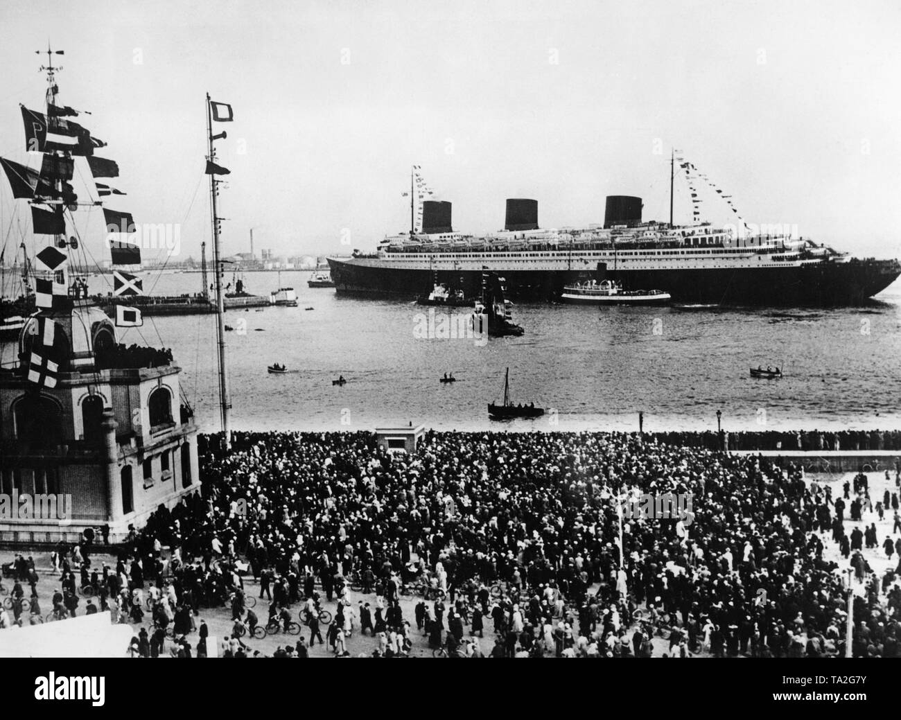 The French ocean liner "Normandie" is put into her home port of Le ...