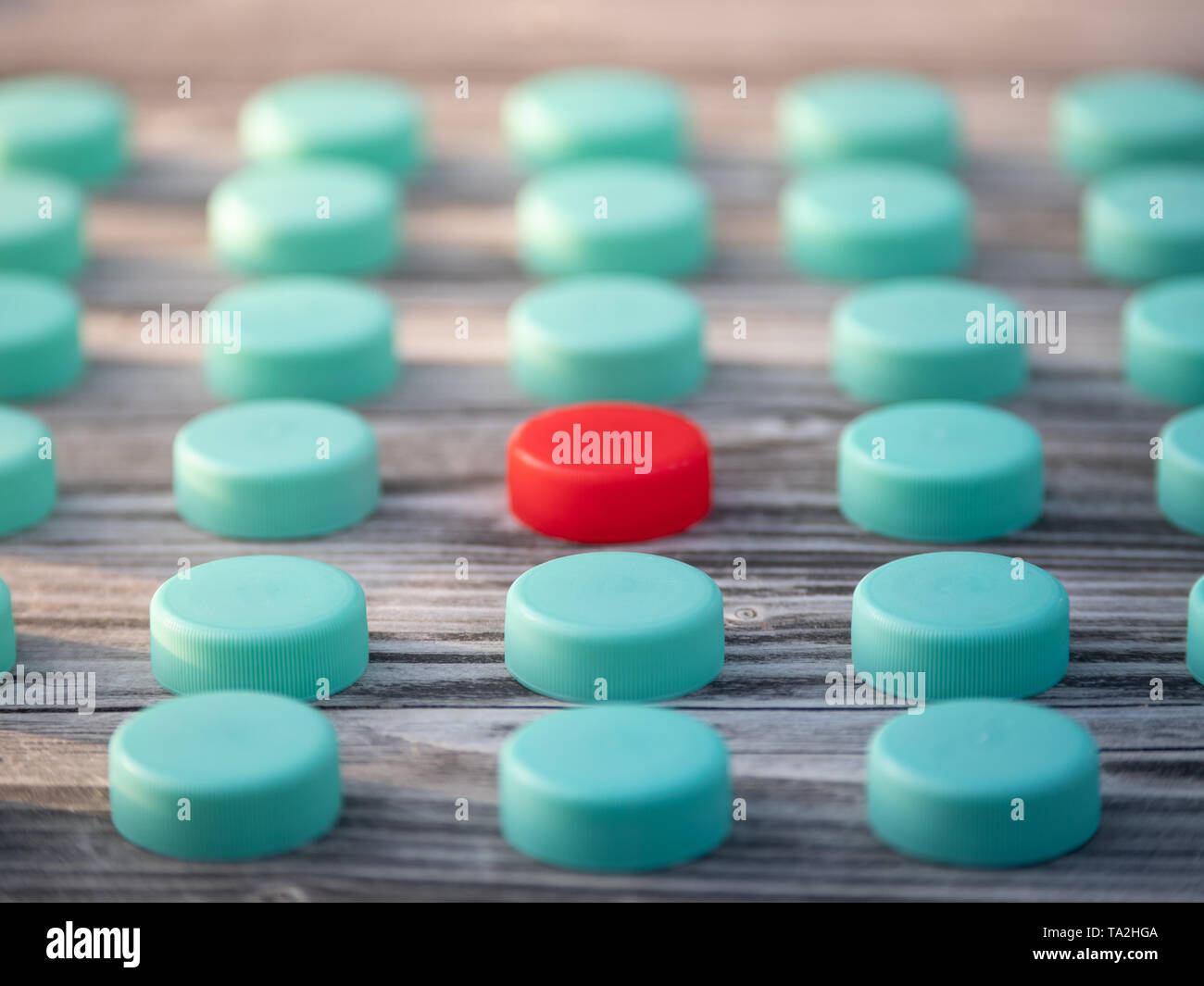 Image of different colored plastic caps on wooden background Stock ...