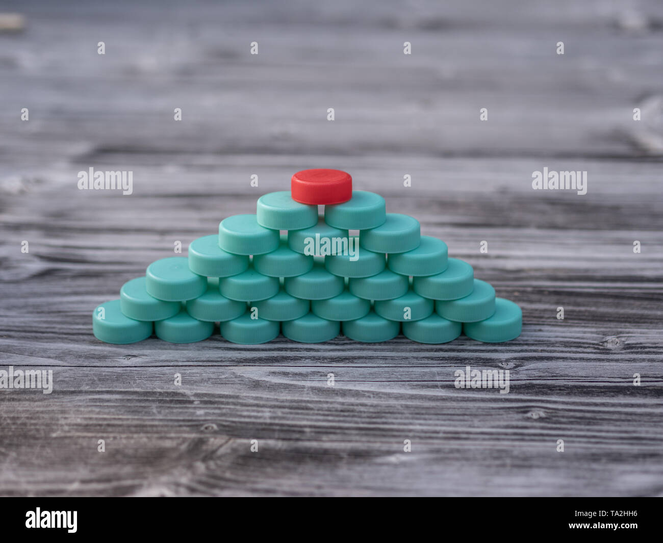 Image of different colored plastic caps on wooden background Stock ...