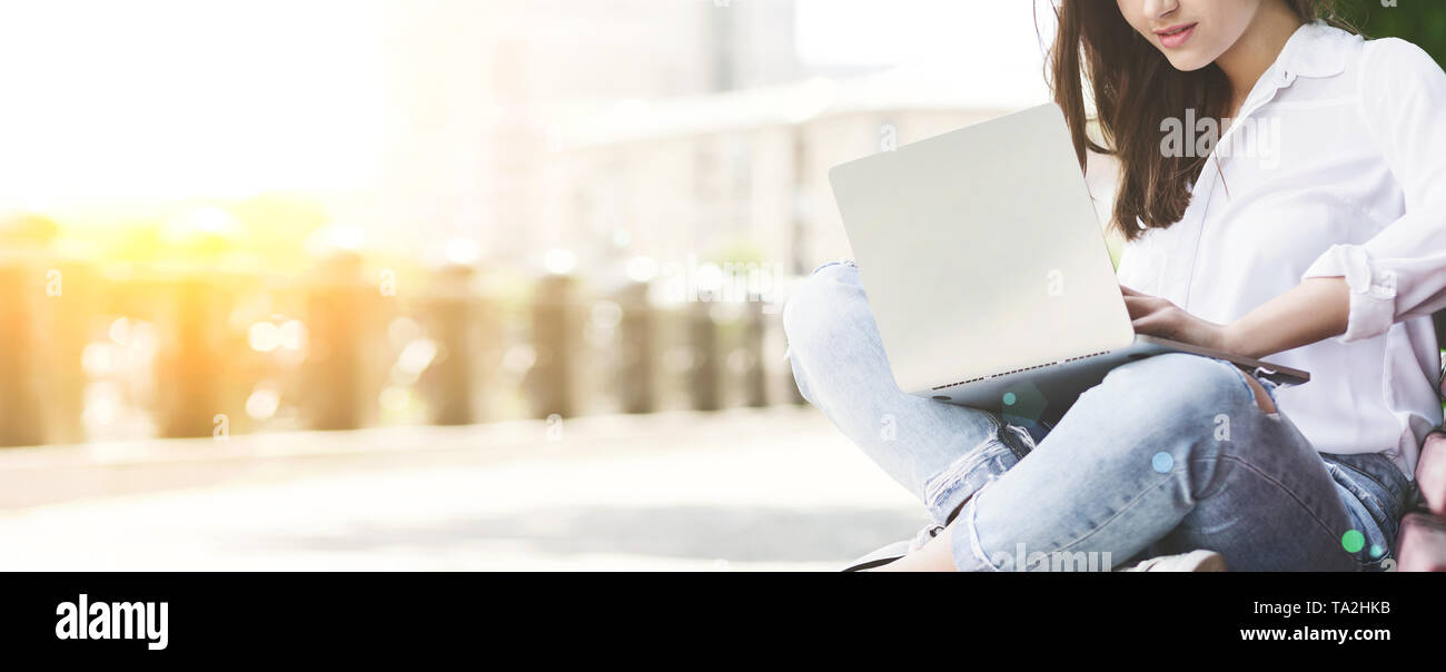 Young female student studying outdoor at summer evening Stock Photo - Alamy