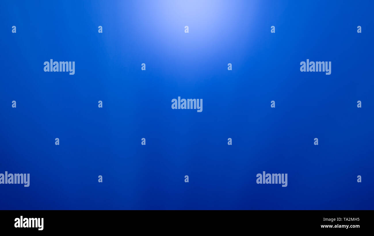 Beautiful seascape of sun light rays shining throught the water surface ...