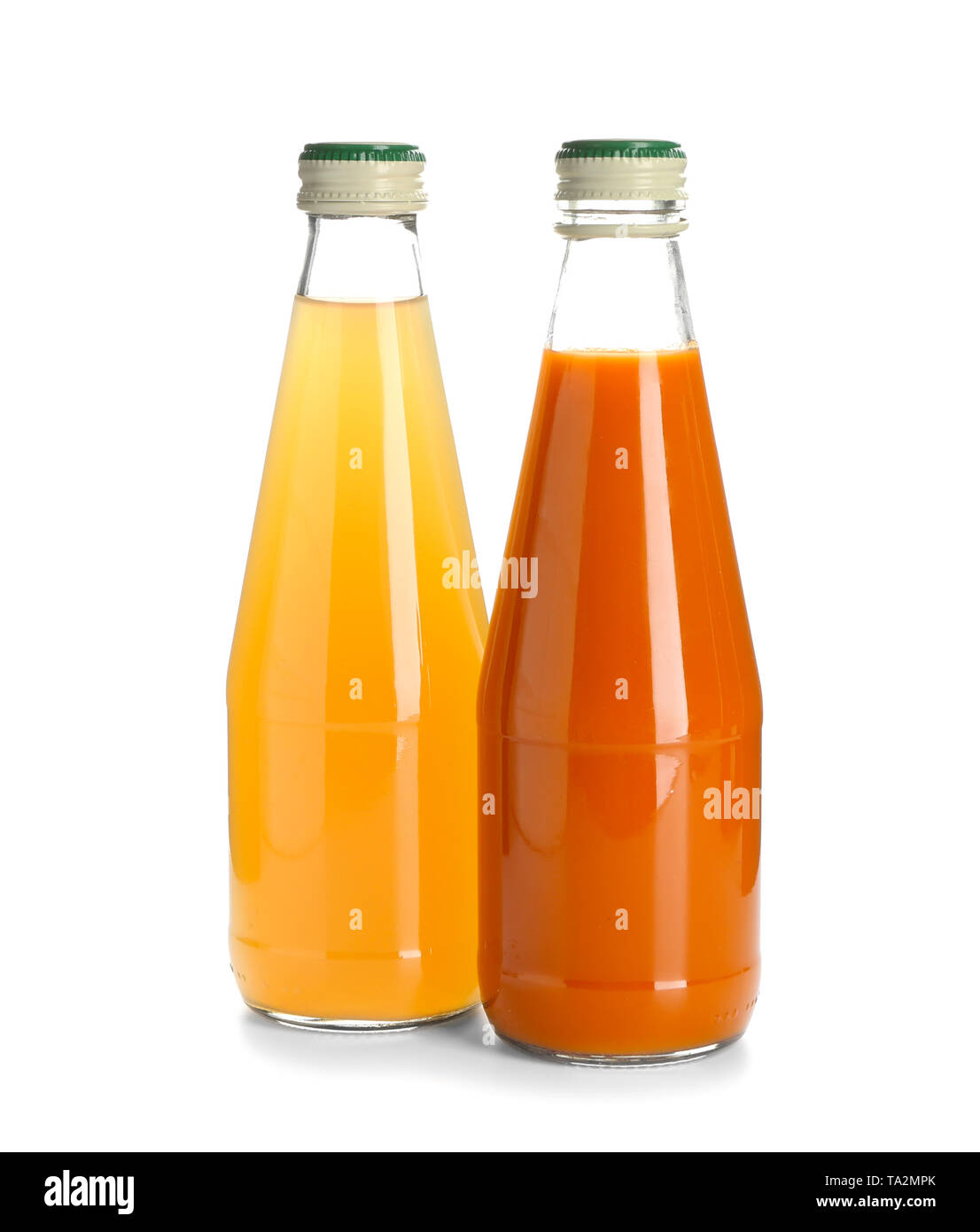 Bottles of healthy vegetable juice on white background Stock Photo - Alamy