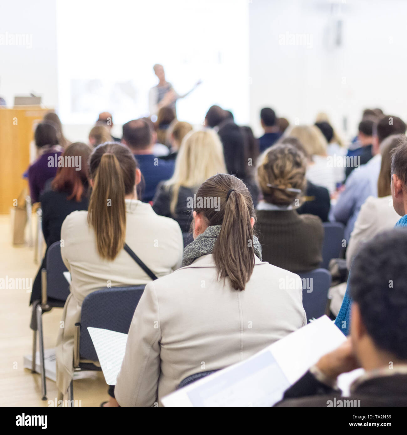 Woman giving presentation on business conference Stock Photo - Alamy