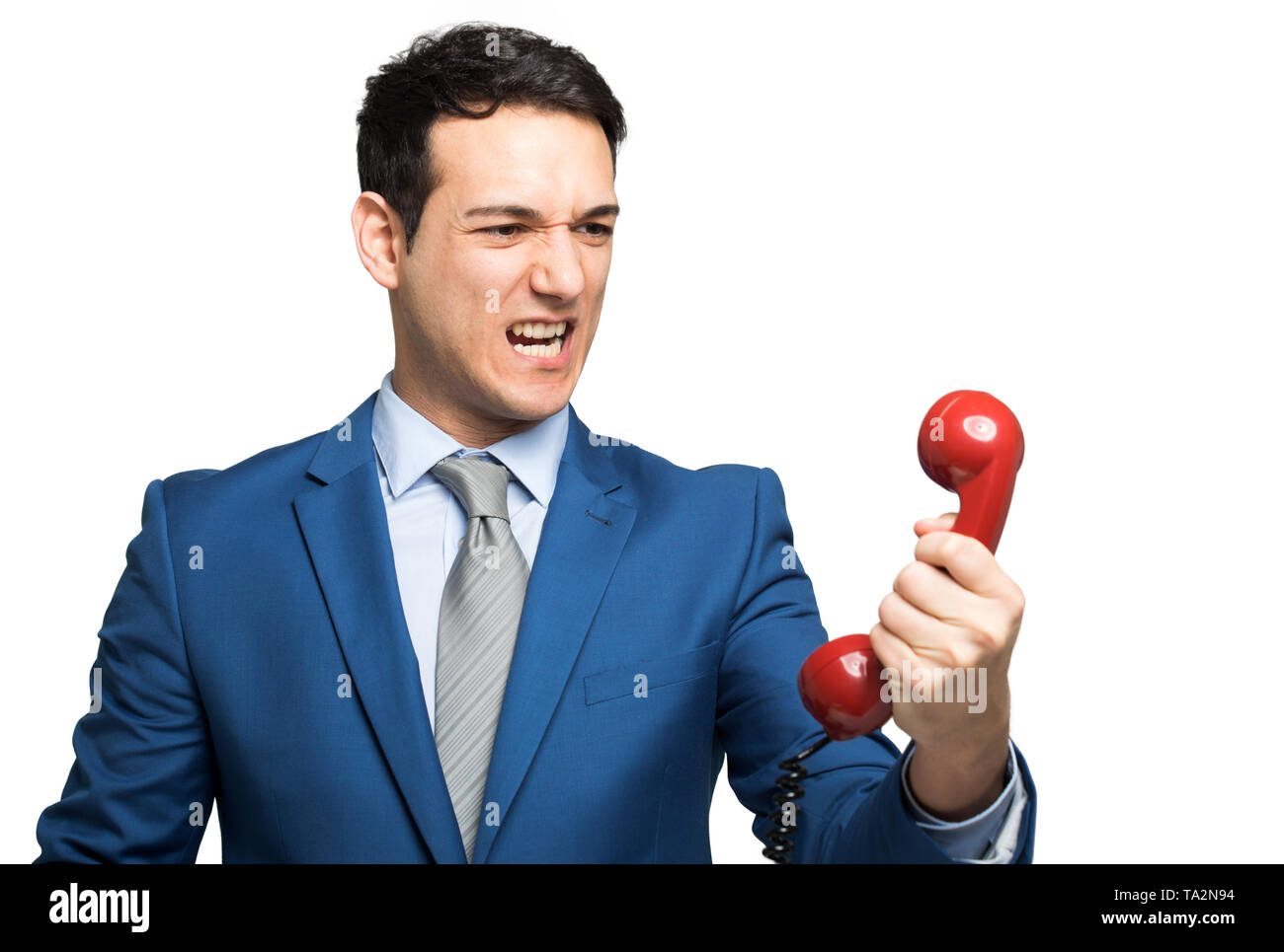 Angry businessman shouting on the phone Stock Photo - Alamy