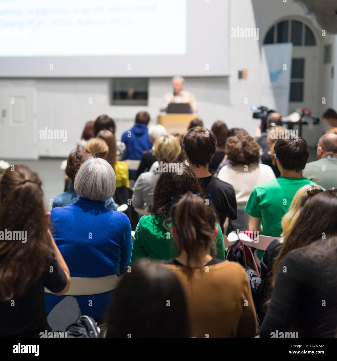 Man giving presentation in lecture hall at university Stock Photo - Alamy