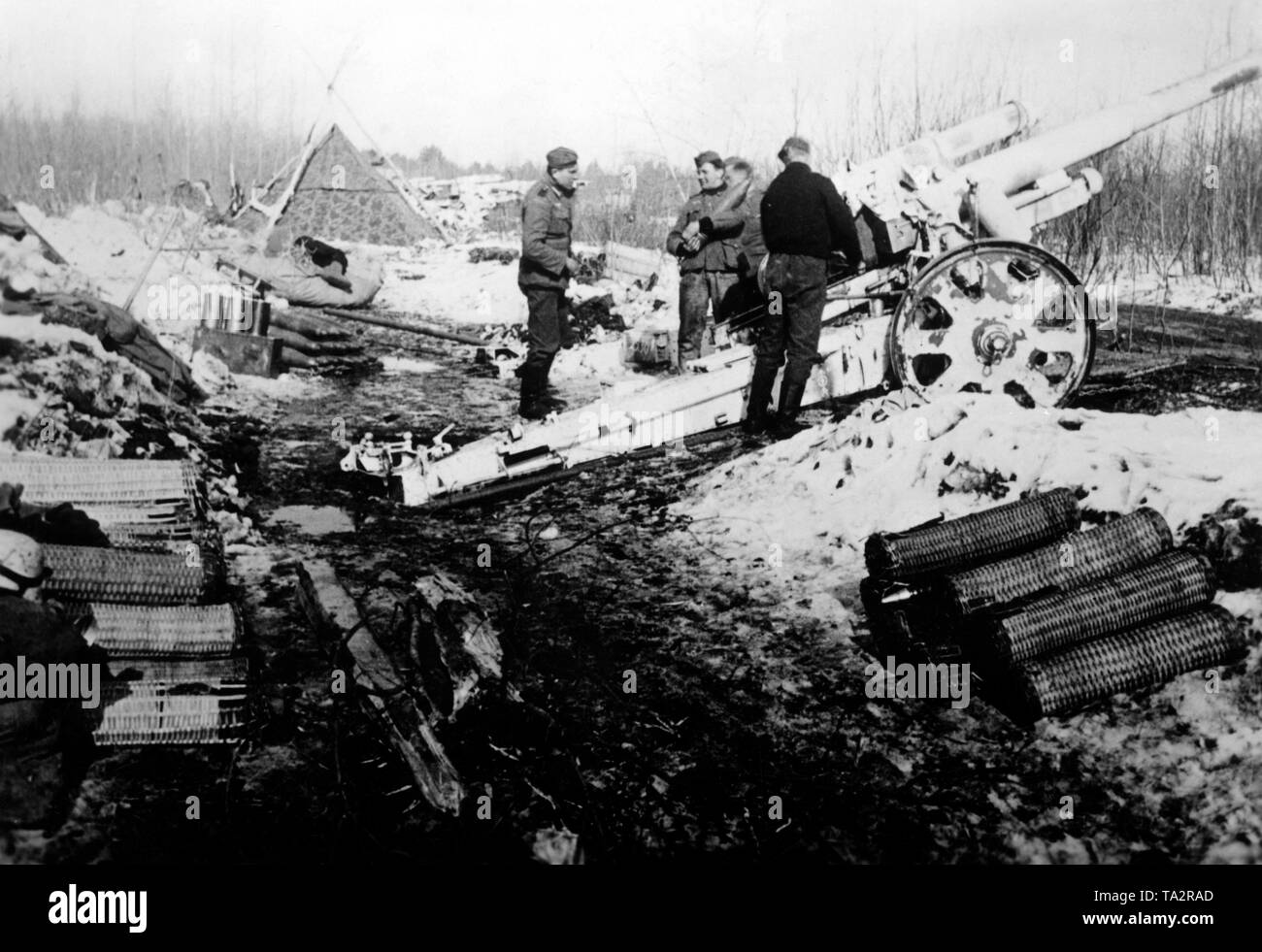 German soldiers beside a heavy field gun south of Lake Ilmen. Their ...
