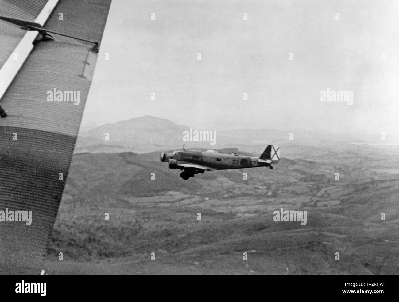 The photo shows a German Junkers Ju 52 transport aircraft with the ...