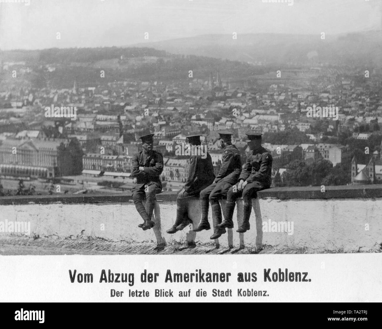 Four US soldiers take a look at the city of Koblenz, their former ...