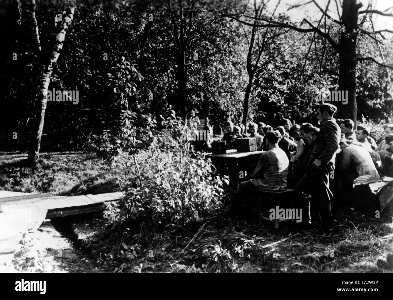 German soldiers of a battery of the Kriegsmarine listen to a speech of ...