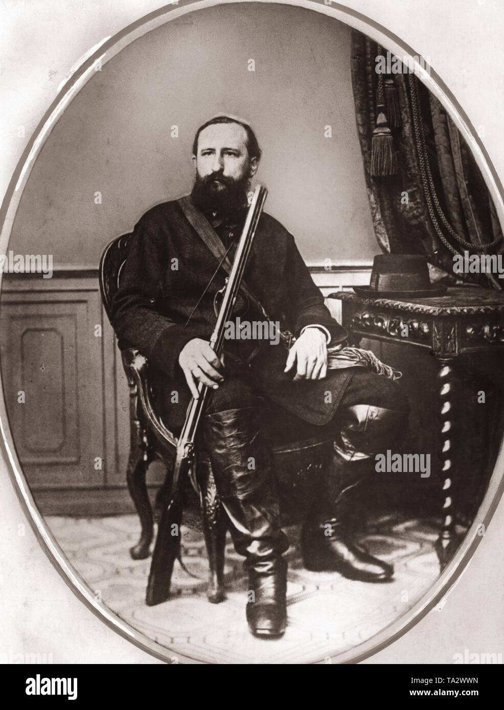 German Zoologist Alfred Brehm poses with a hunting riffle Stock Photo ...
