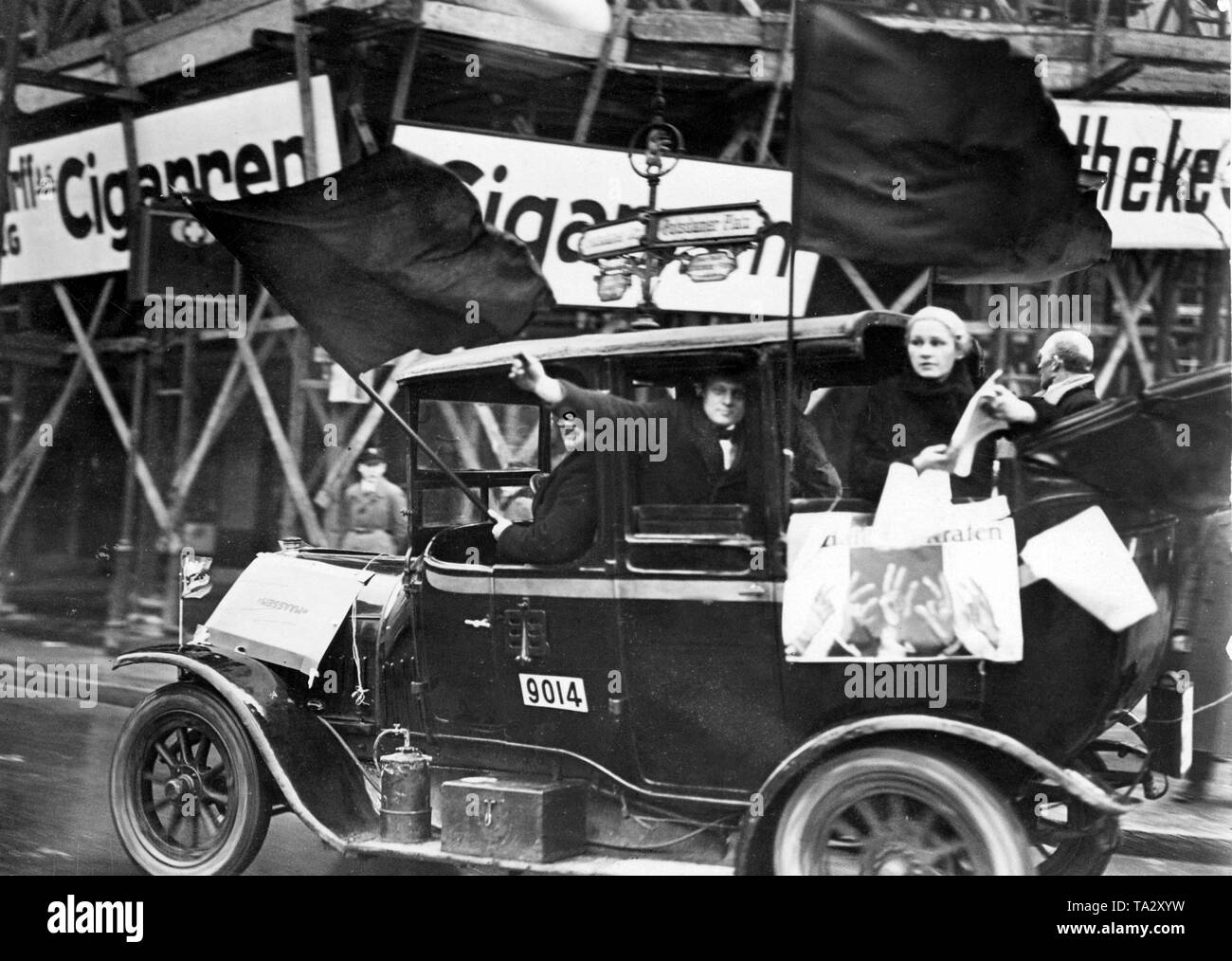 A propaganda car of the SPD decorated with red flags at Potsdamer Platz ...