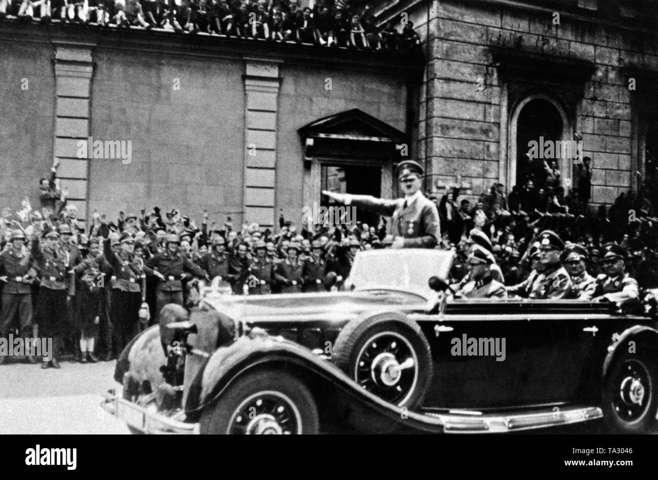 Adolf Hitler in the car on his way to his private apartment after ...