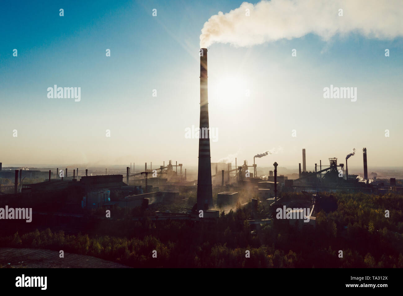 industrial landscape with heavy pollution produced by a large factory ...