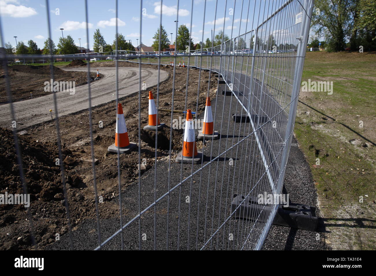 Traffic cones behind a fence Stock Photo - Alamy