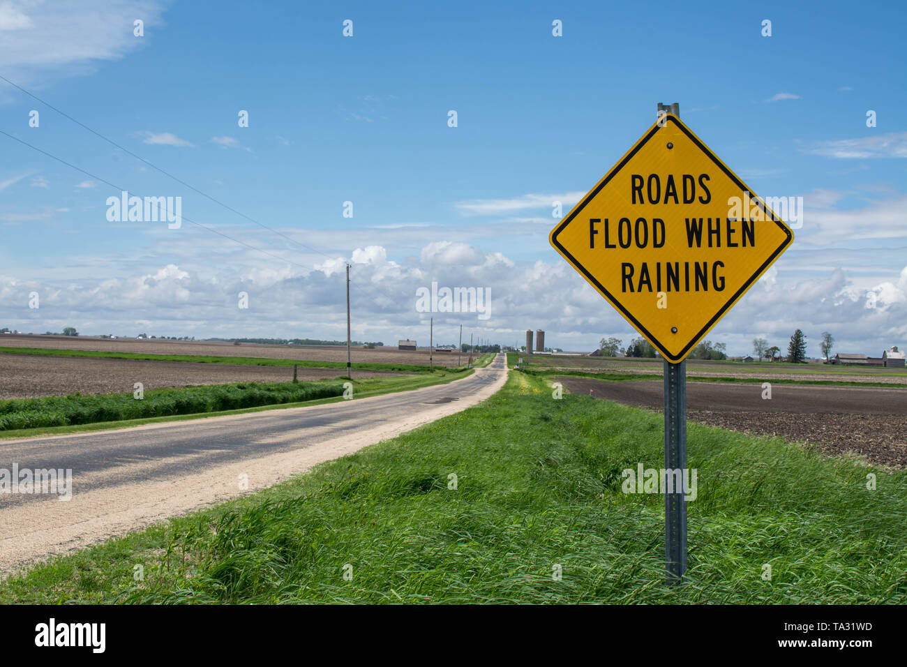 Roads flood when raining warning sign in rural Illinois Stock Photo - Alamy
