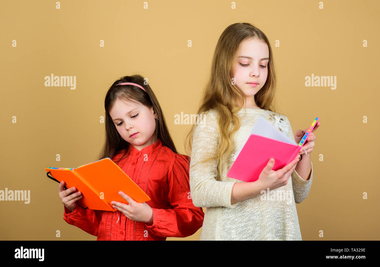 Kids girls with books or notepads. Education and kids literature ...