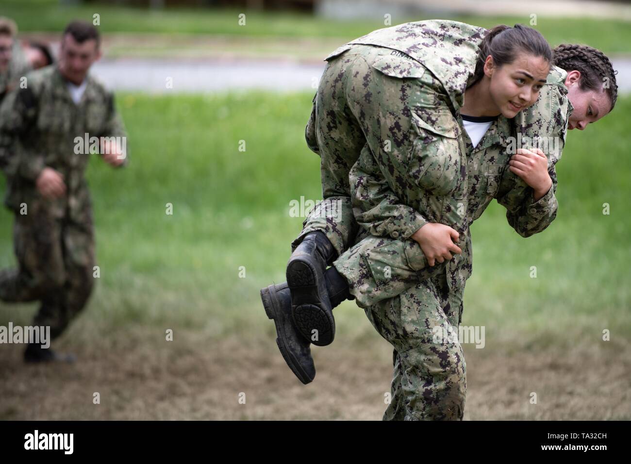 Firemans carry hi-res stock photography and images - Alamy