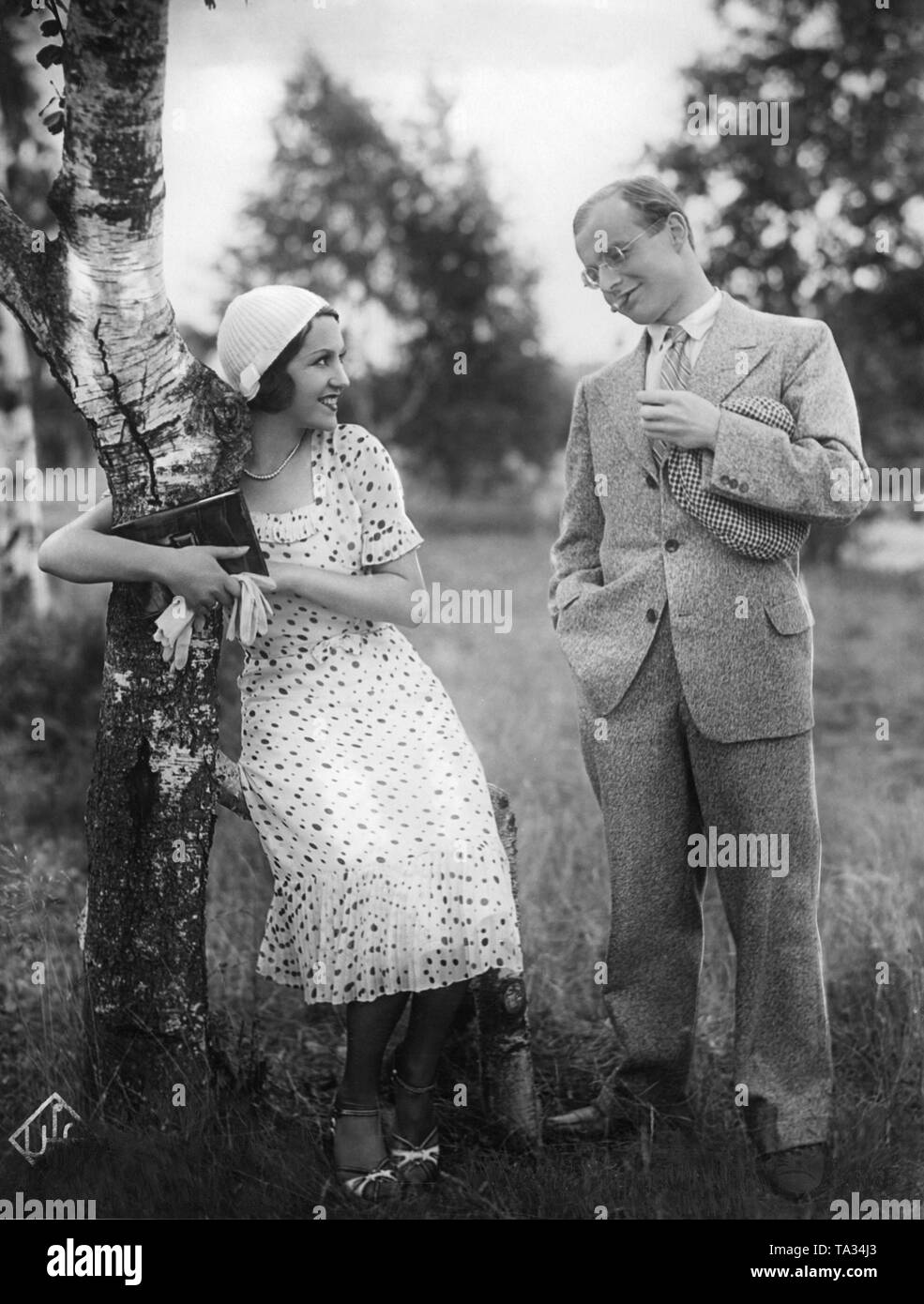 Heinz Ruehmann as bank clerk Peter Bergmann (right) and Kaethe von Nagy ...