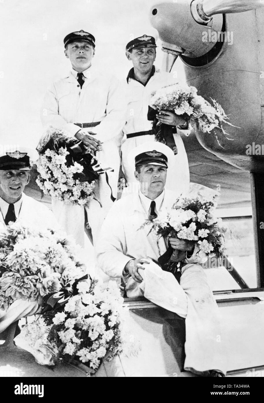 The crew of the flying boat Dornier Do 18 D-ANHR after setting up an ...