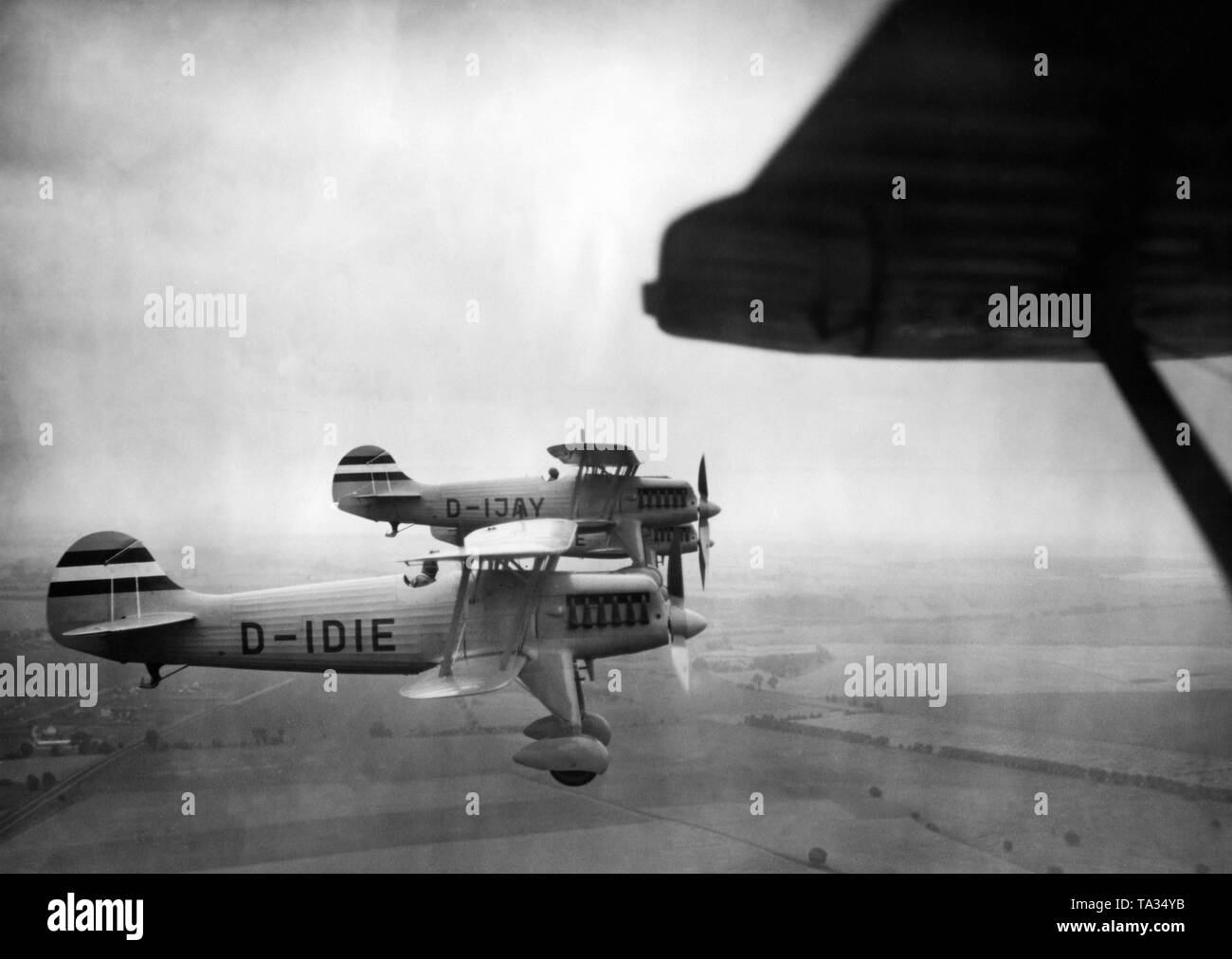 Three planes of the type Heinkel He 51 during a training flight of the ...