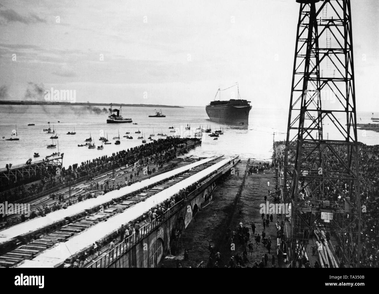 The hull of "Normandie" after her launch in Saint-Nazaire Stock Photo ...