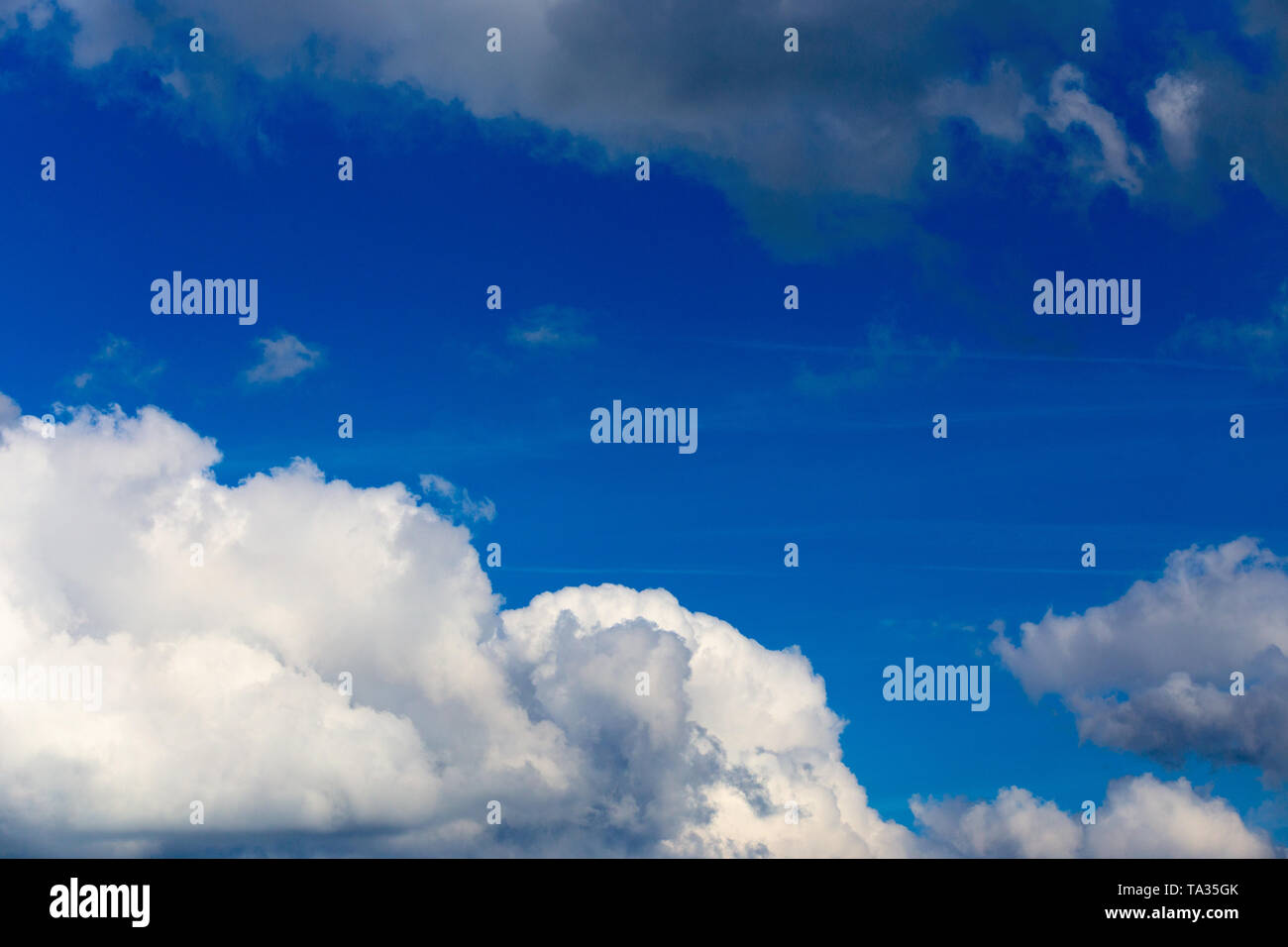 Regular spring clouds on blue sky at daylight in continental europe ...