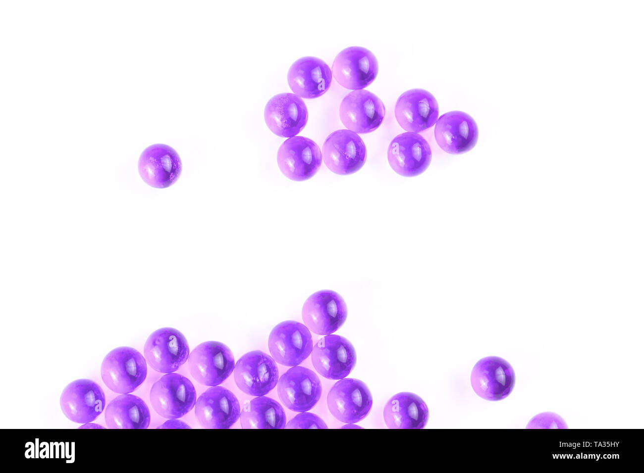 proton purple spherical ball capsules with selective focus isolated on ...