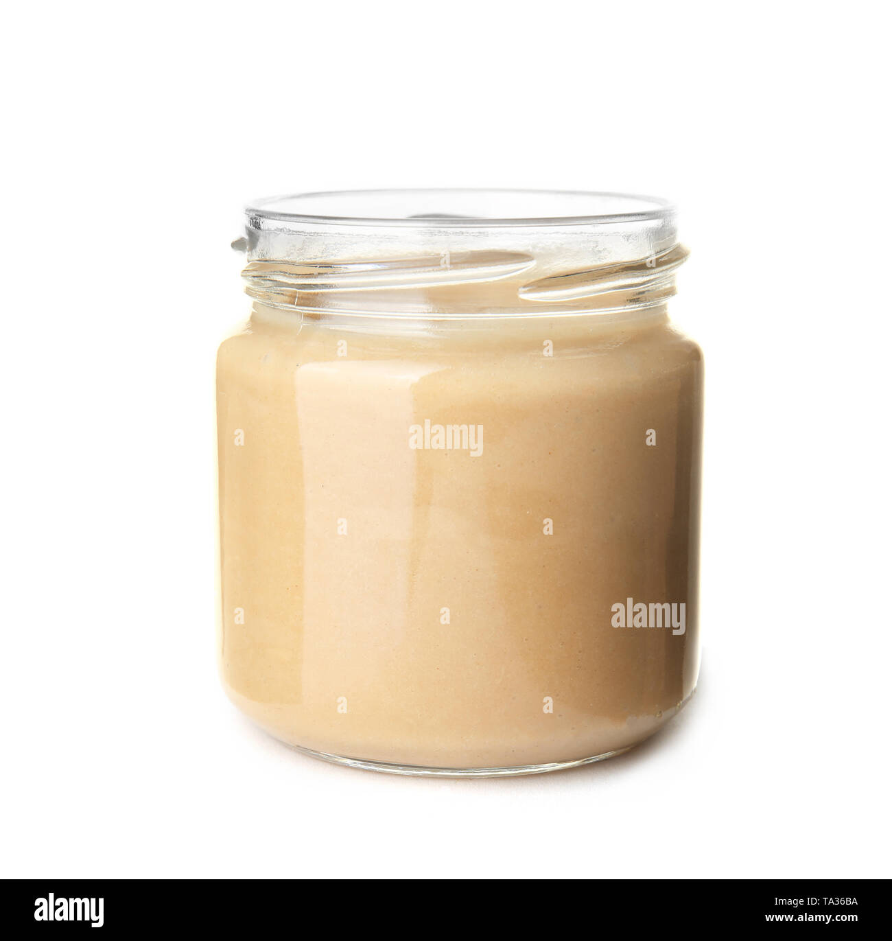 Jar of tasty tahini on white background Stock Photo - Alamy