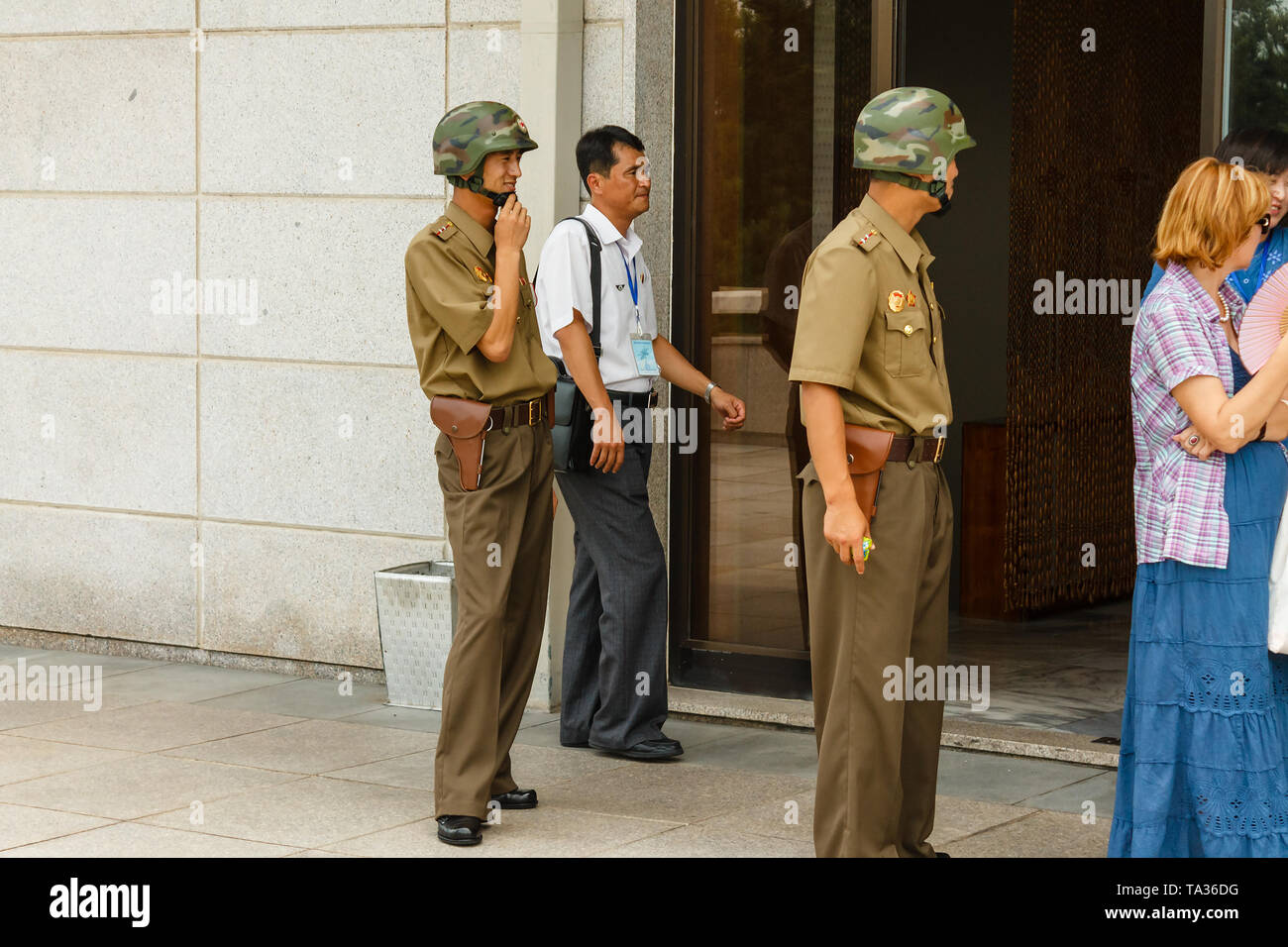 Panmunjom, North Korea - July 30, 2014: North Korean soldiers guard ...