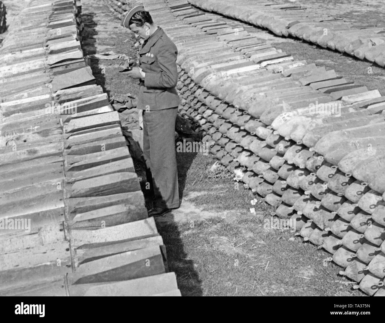 A first lieutenant of the Condor Legion inspects the bomb stock of ...