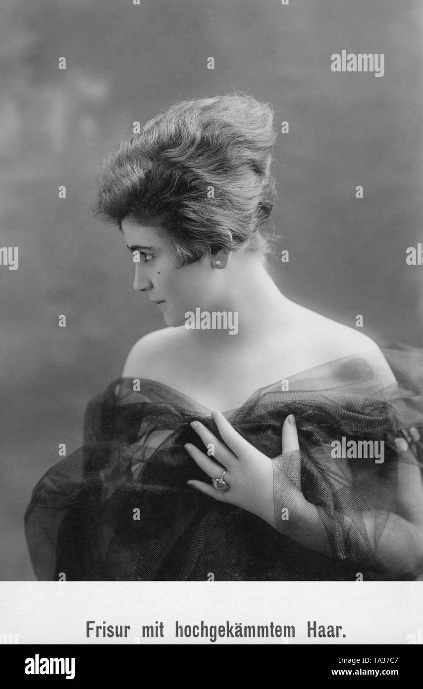 Woman portrait with contemporary hair fashion. The hair is combed up ...