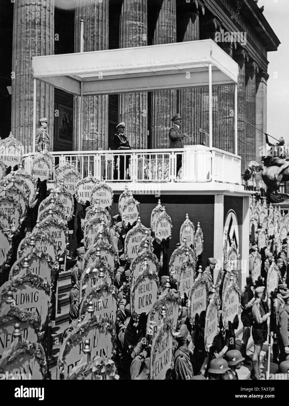 Adolf Hitler during a speech under a canopy with a swastika during the ...