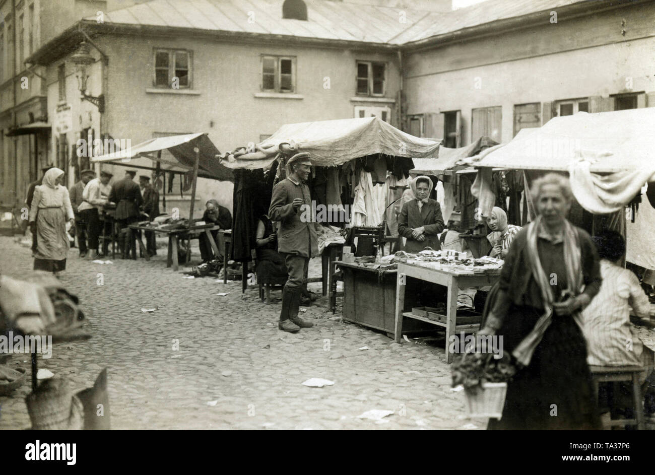 A member of the German Freikorps "Iron Division" examines the goods of ...
