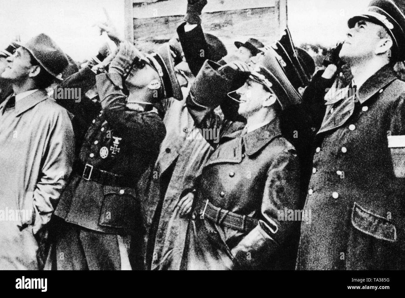 Joseph Goebbels (2nd from right) and Albert Speer (right) watch an ...