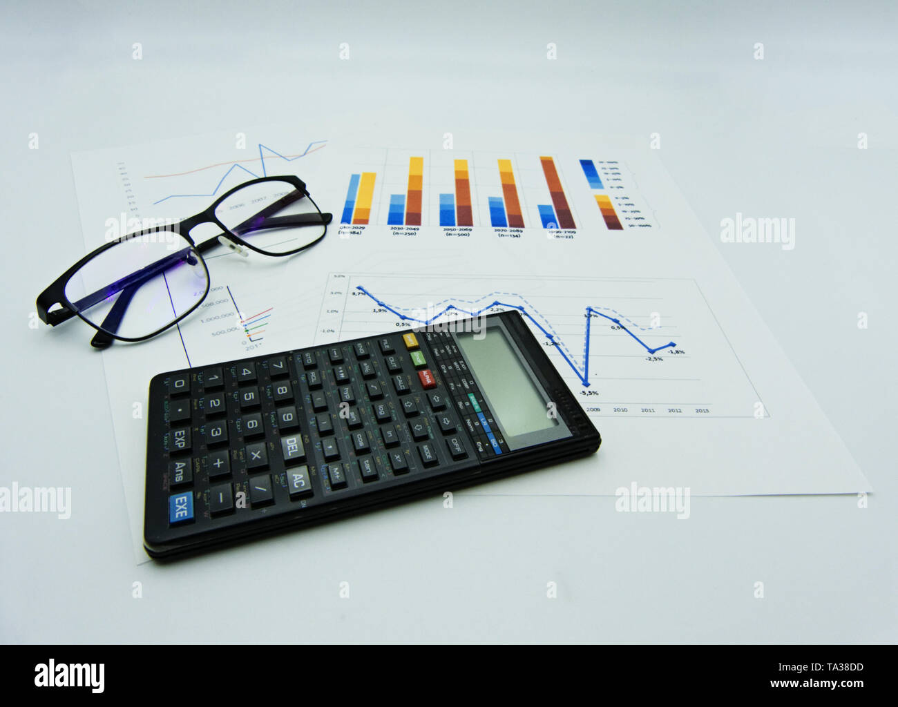 Data graphs and diagrams, glasses and calculator, white background ...