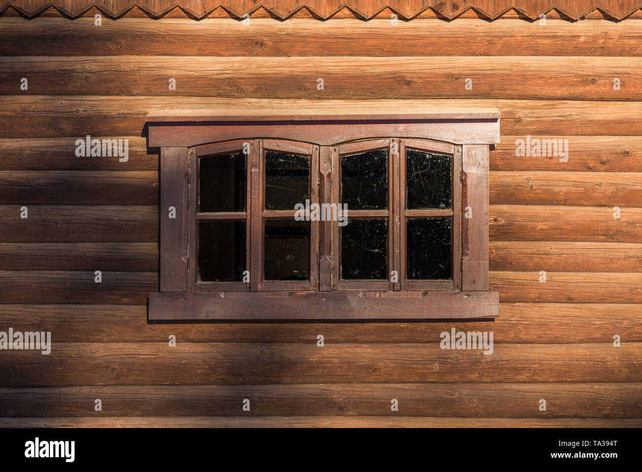 log wall with one centered window Stock Photo - Alamy