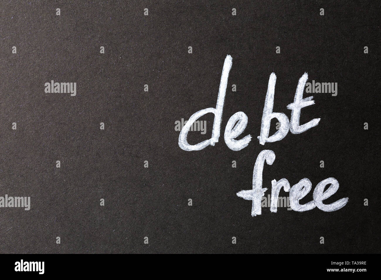 Text DEBT FREE on dark background Stock Photo - Alamy