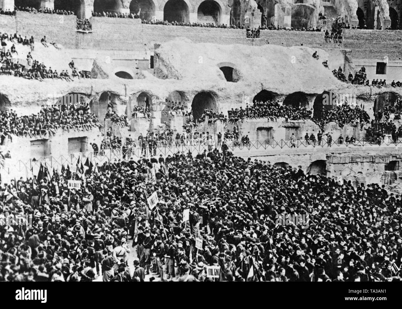 Solemn set up of a cross in the Colosseum in Rome. The re-erection of ...