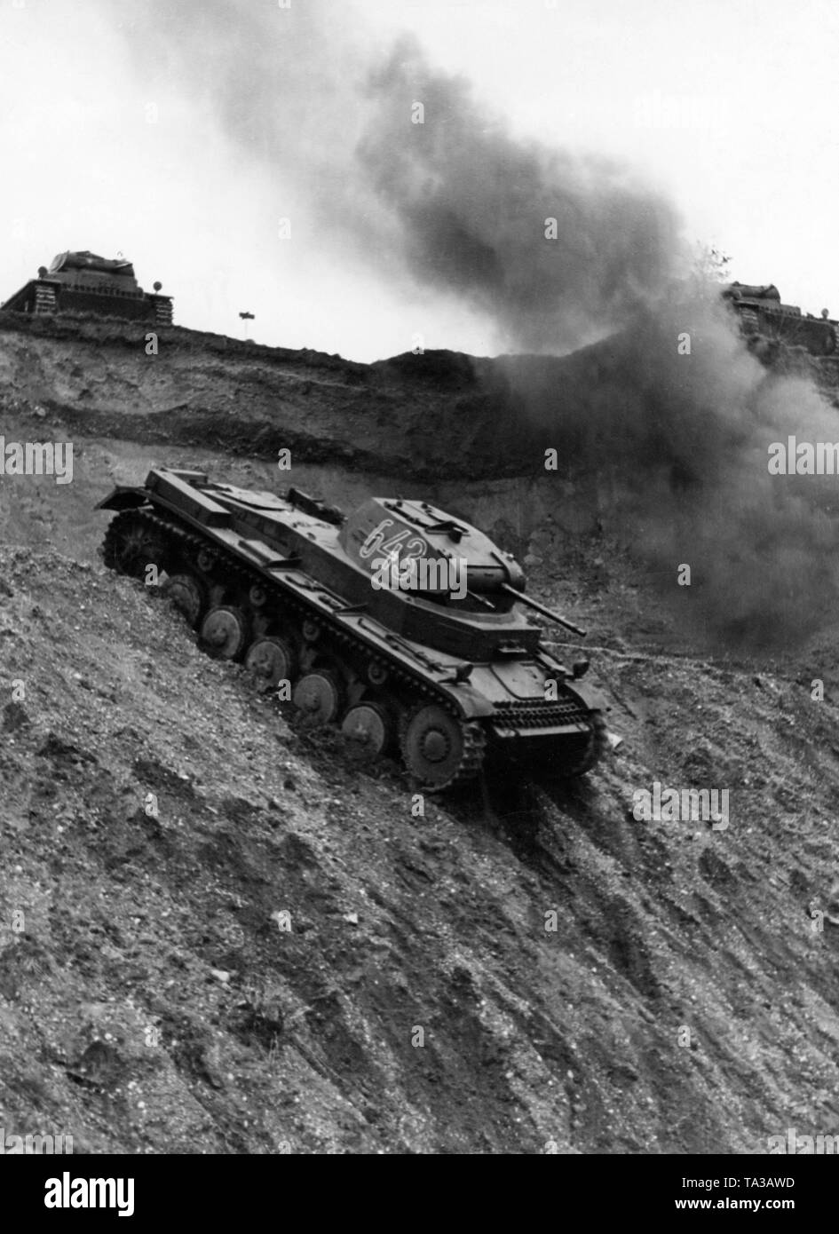 Panzer II cross a steep slope during the Western campaign Stock Photo ...
