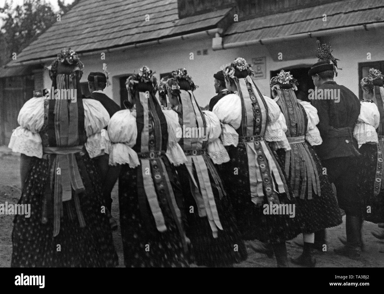 Bridesmaids in traditional dress at a wedding in Lomnicka, formerly ...