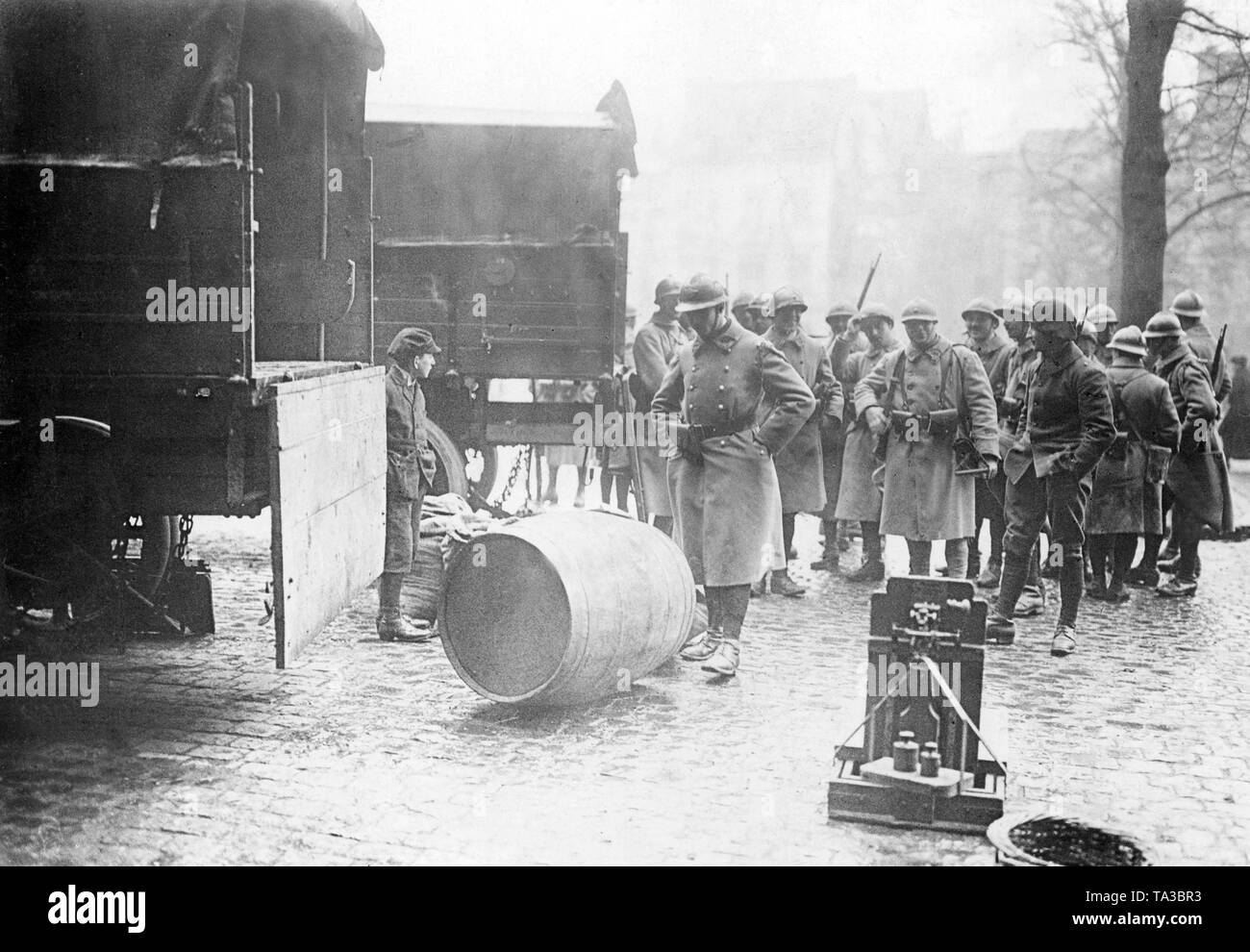 French soldiers of the occupation forces confiscate food for their own ...