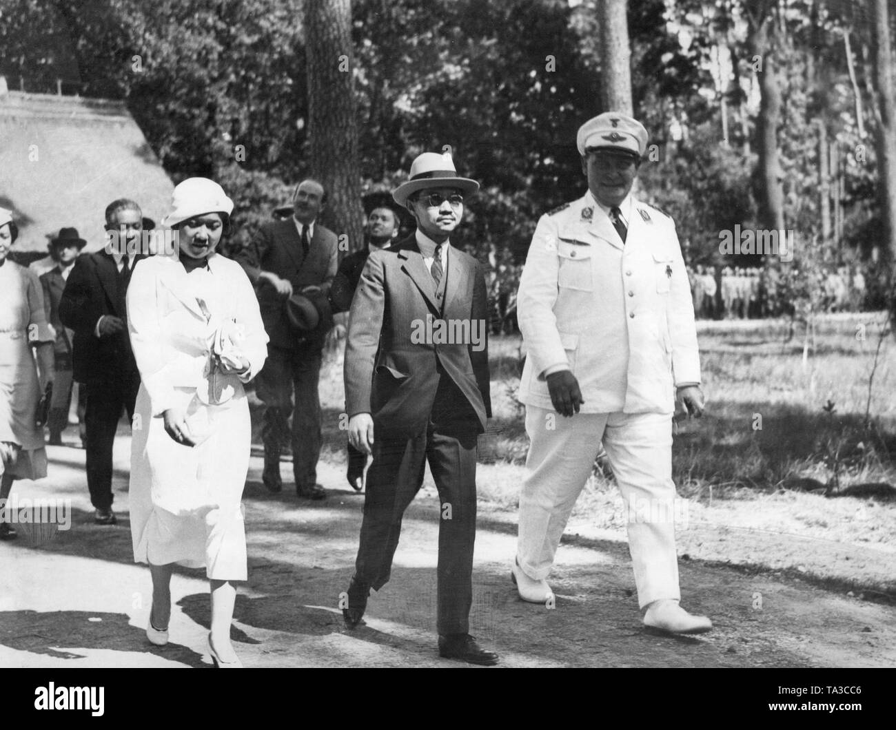 Hermann Goering (right) walking with the royal family of Siam across ...