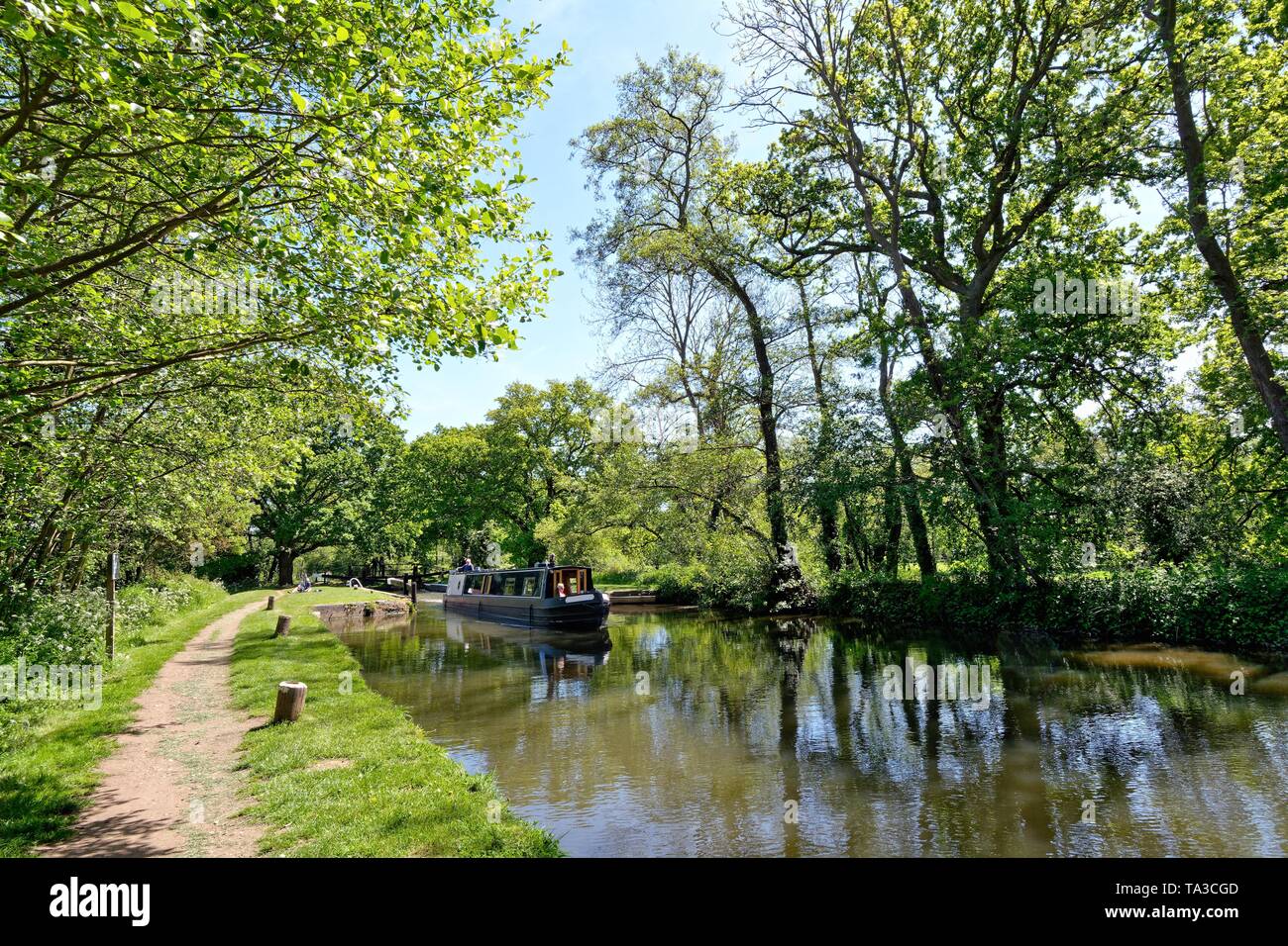 A narrow boat passing through Newark lock on the River Wey Navigation ...