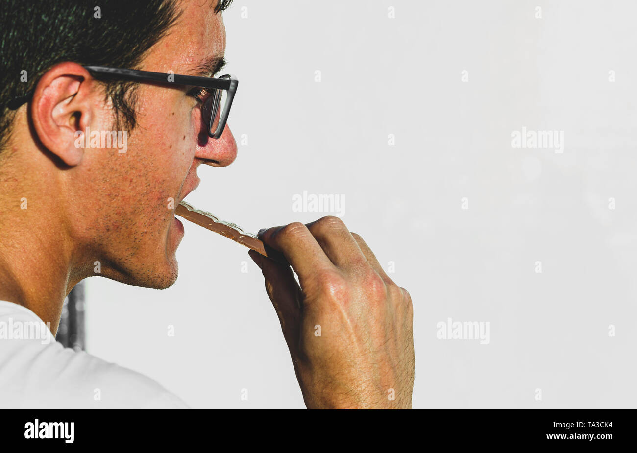 Man eating chocolate hi-res stock photography and images - Alamy