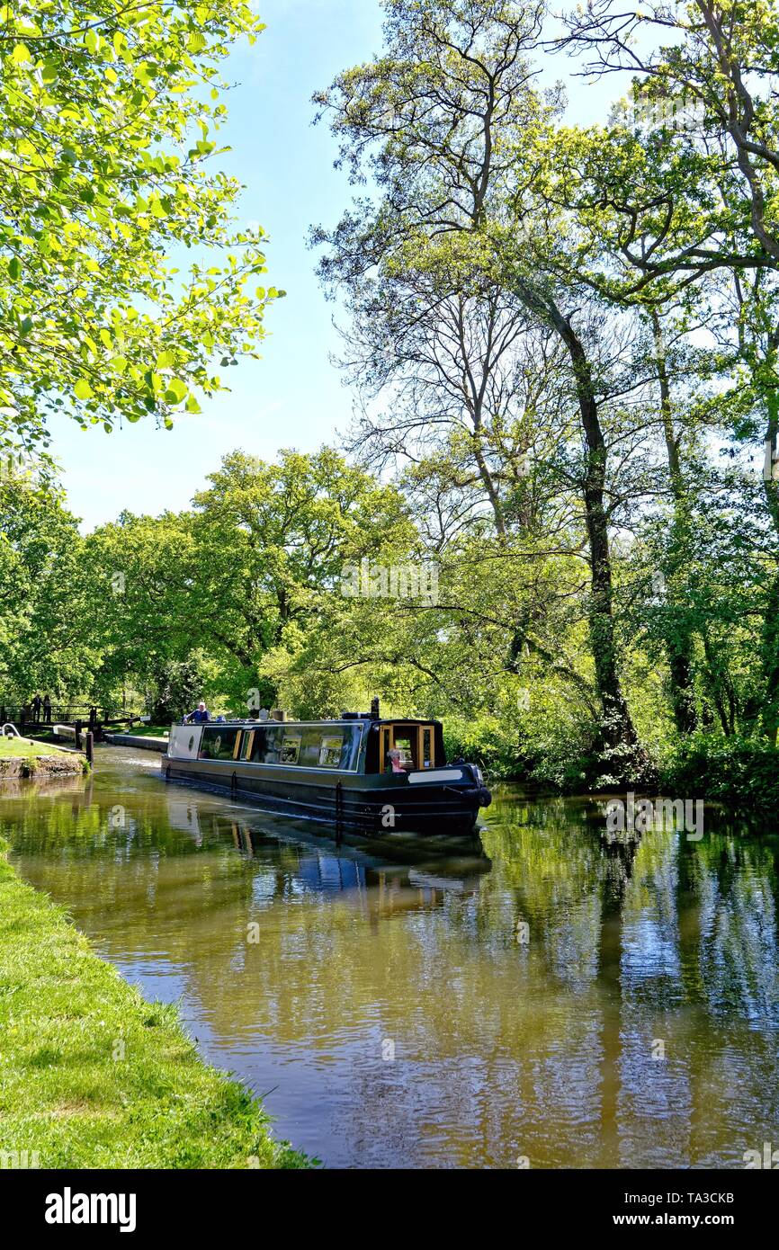 A narrow boat passing through Newark lock on the River Wey Navigation ...