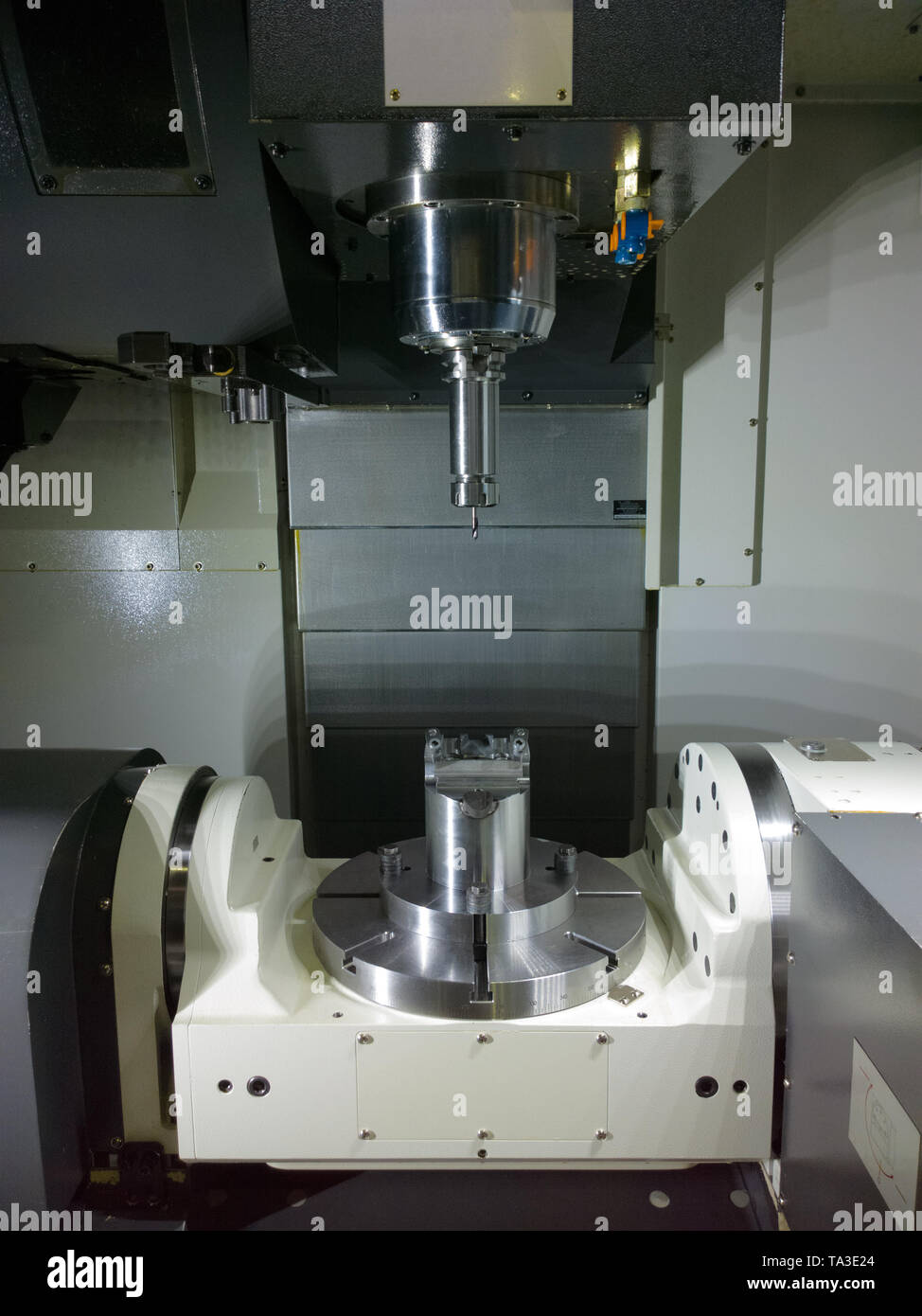 The five-axis Computer Numerical Control CNC machine waiting for stock ... The five-axis Computer Numerical Control CNC machine waiting for stock ...