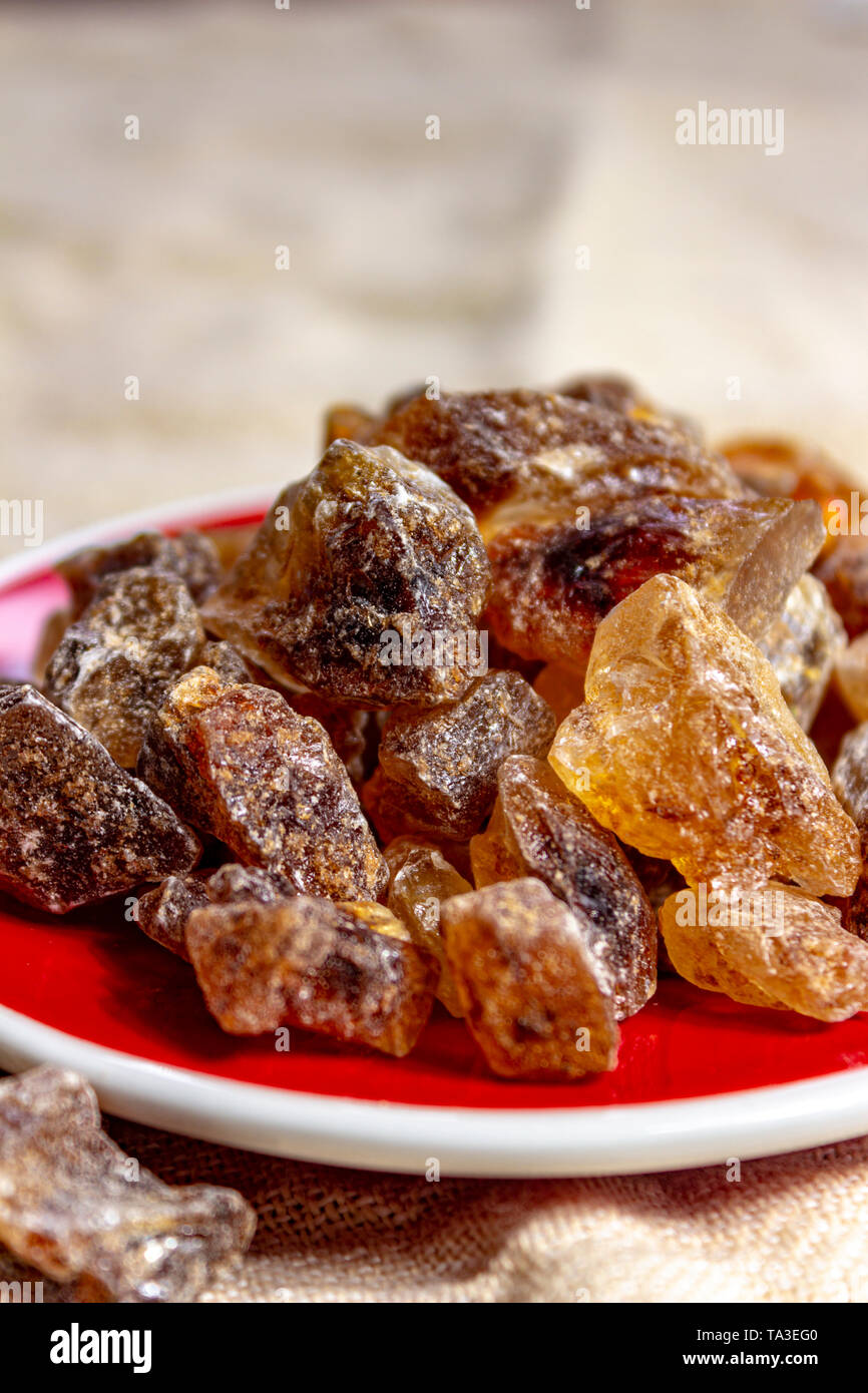 Crystals of candy sugar, traditional brown rock sugar originally from ...