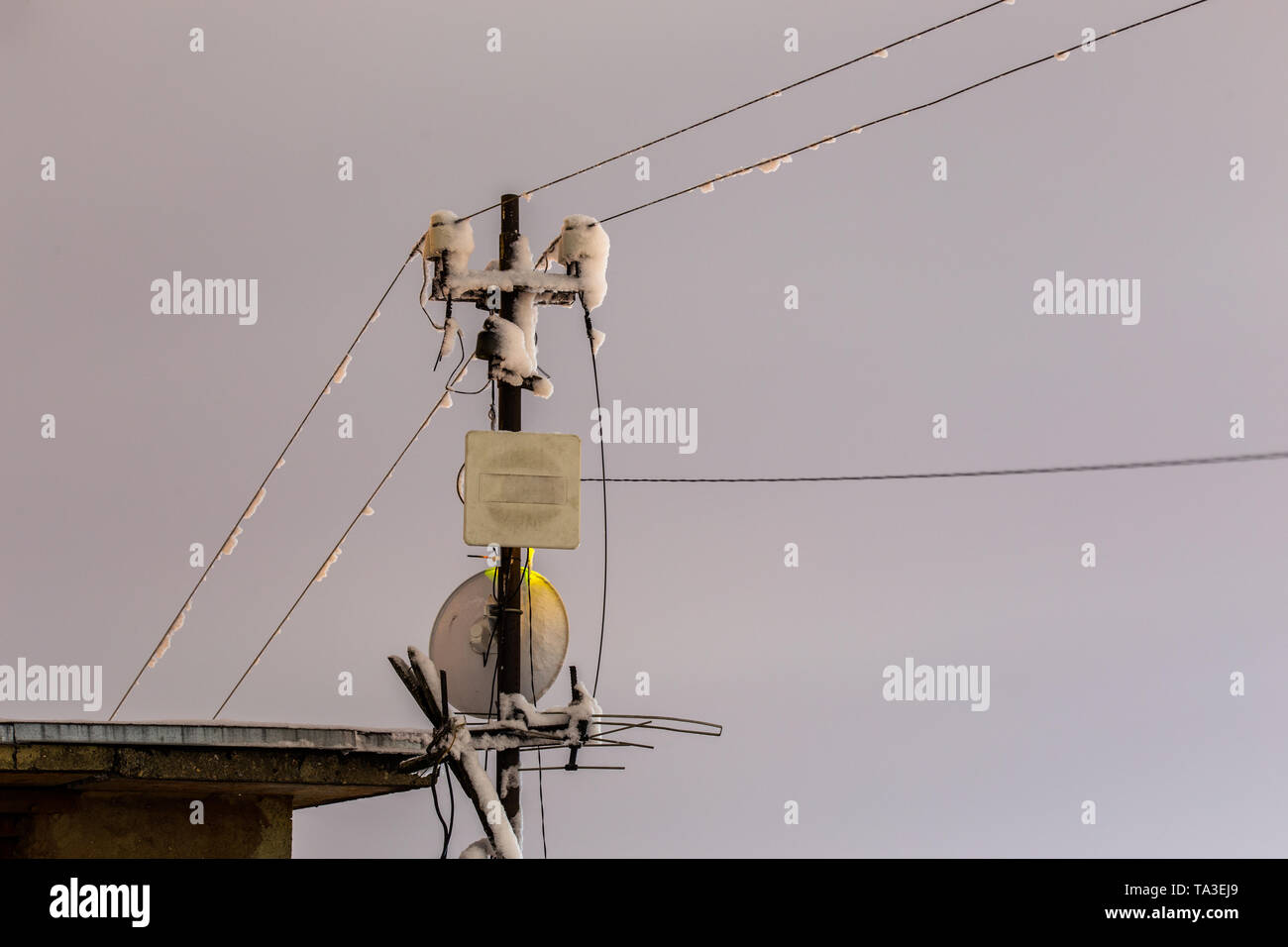 Frozen 5 GHz wireless repeater antennas pillar at winter night Stock ...