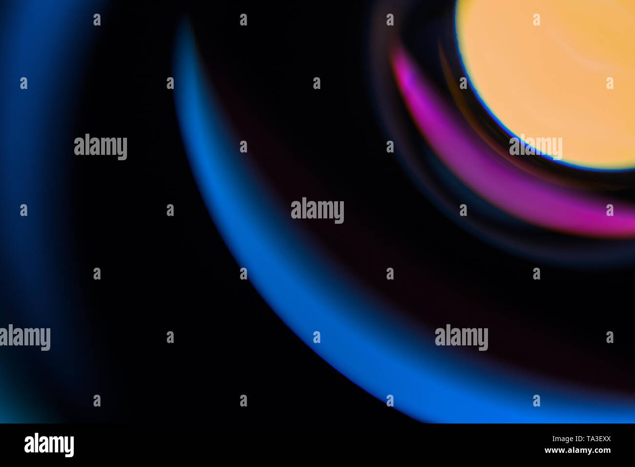 abstract dark round blur, made from back lighted defocused lens system ...