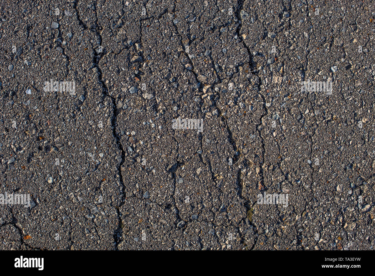 cracked across flat asphalt texture with hard direct sunlight Stock ...